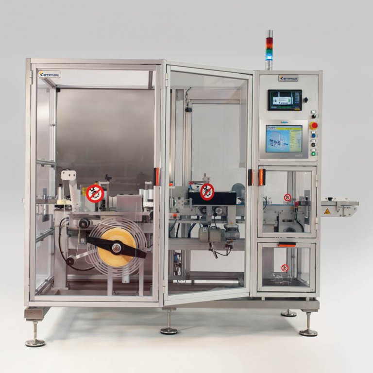 Wrap around labelling machine for pharmaceutical vials and ampoules