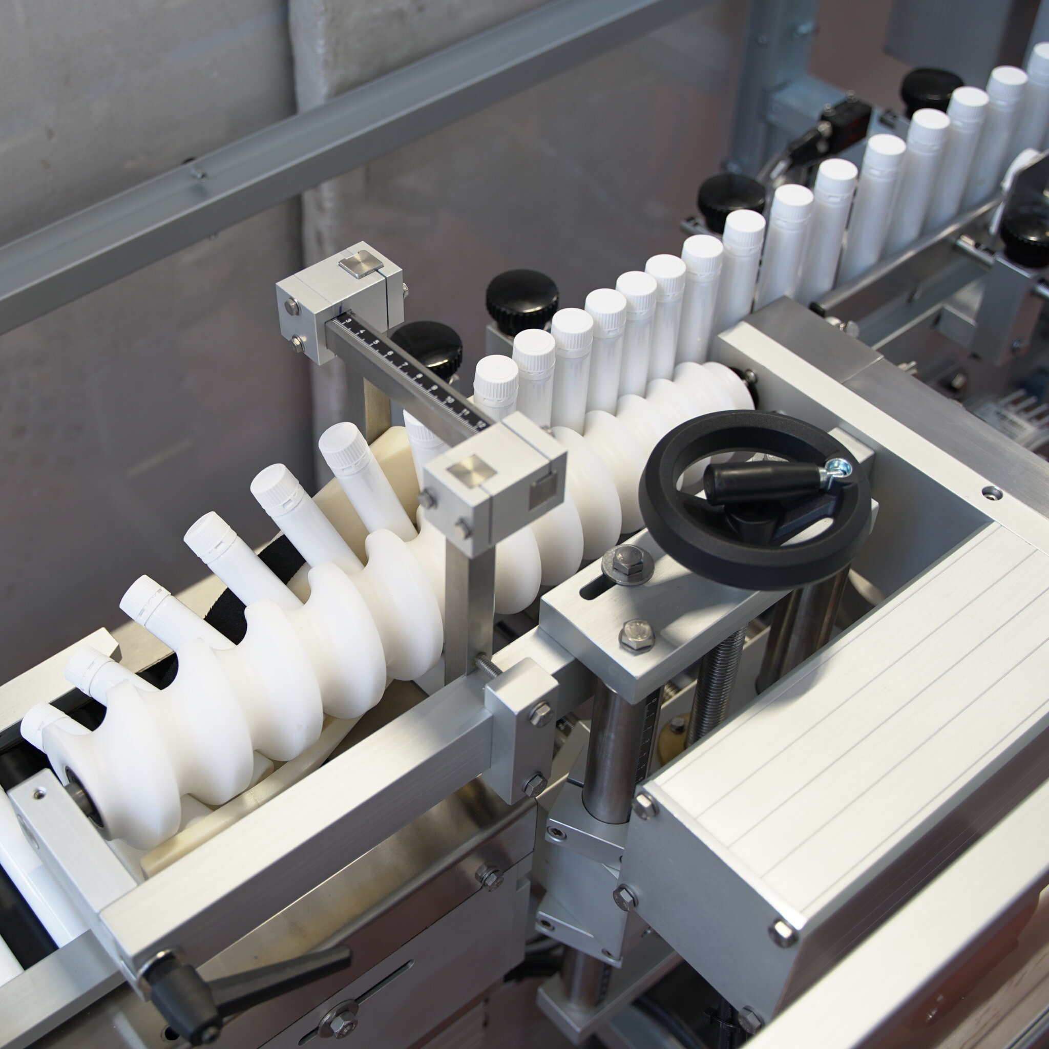 Labelling machines, label applicators and friction feeders