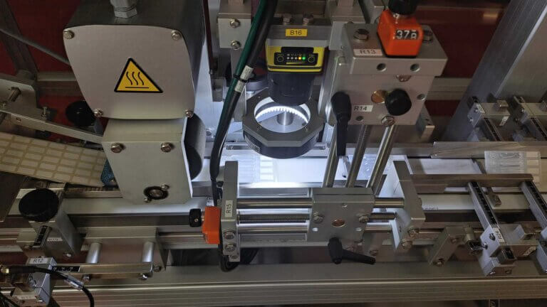Labelling machines, label applicators and friction feeders