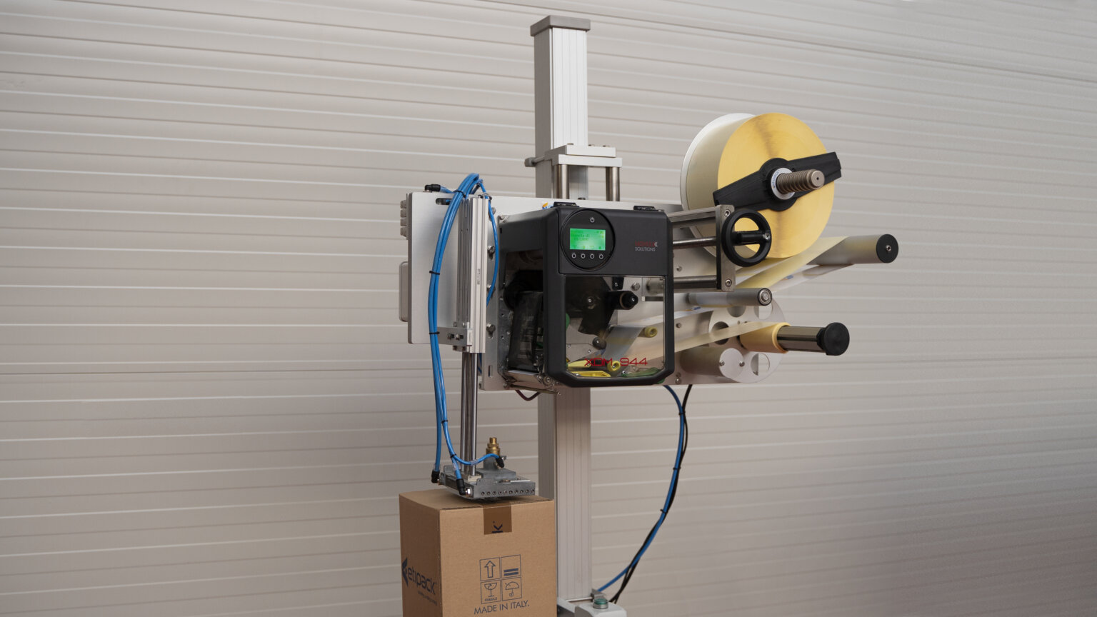 Labelling machines, label applicators and friction feeders