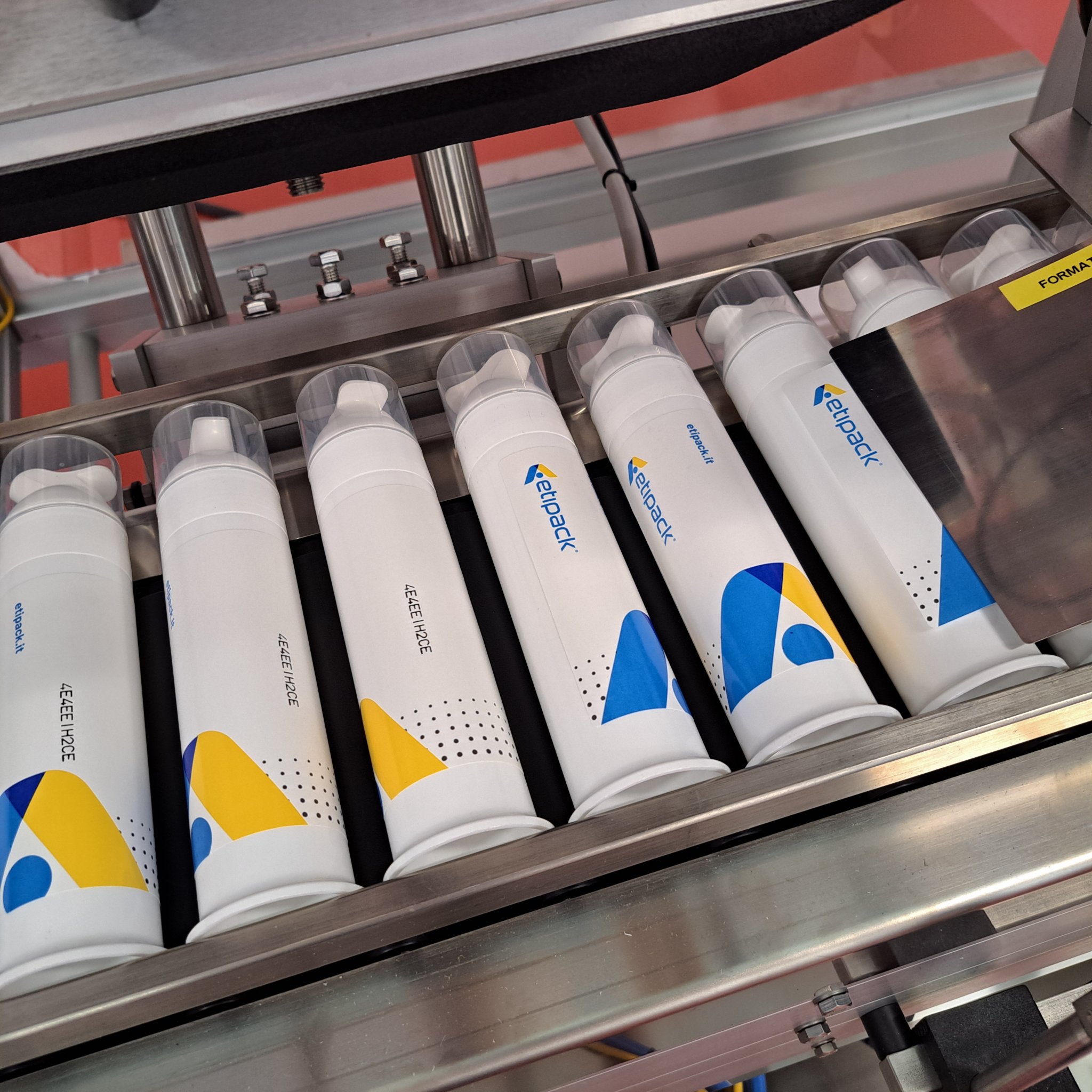 Labelling machines, label applicators and friction feeders